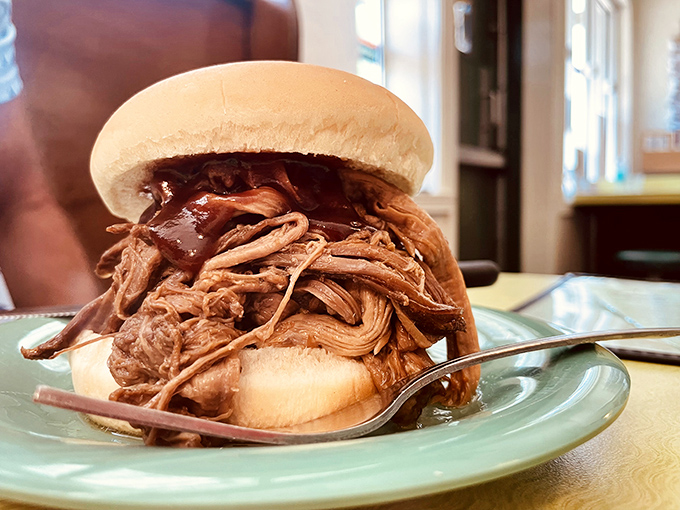 This pulled pork sandwich isn't just food&mdash;it's an edible time machine to simpler days when happiness came between two buns.