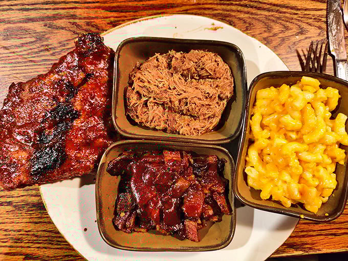 BBQ nirvana achieved: fall-apart pulled pork, caramelized ribs, smoky burnt ends, and mac & cheese that's definitely not from a blue box.