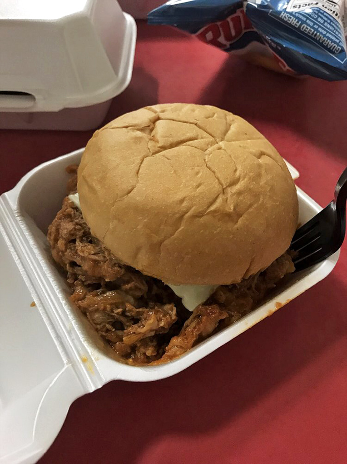 The pulled pork sandwich doesn't need fancy presentation&mdash;when flavor speaks this loudly, white styrofoam becomes fine china.