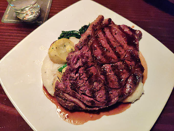 This ribeye's perfect char marks tell the story of flames meeting premium beef in beautiful harmony.