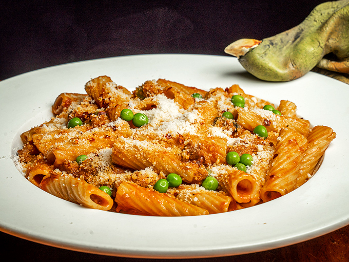 Rigatoni that doesn't apologize for being delicious. The peas add little pops of sweetness that cut through the richness like well-timed jokes at a dinner party.