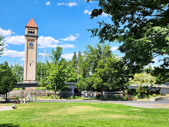 Riverfront Park's clocktower frames a perfect summer day, where blue skies and green spaces remind you why quality of life doesn't have to come with a premium price tag.