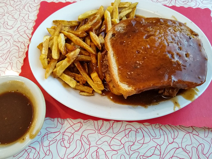 Hot roast beef sandwich with gravy so good you'll want to write home about it&mdash;if you weren't too busy sopping up every last drop.