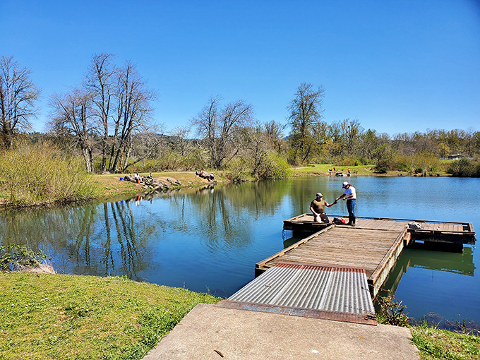 Two fishermen sharing stories on a sunlit dock&mdash;this isn't just recreation, it's the original social network, no Wi-Fi password required.