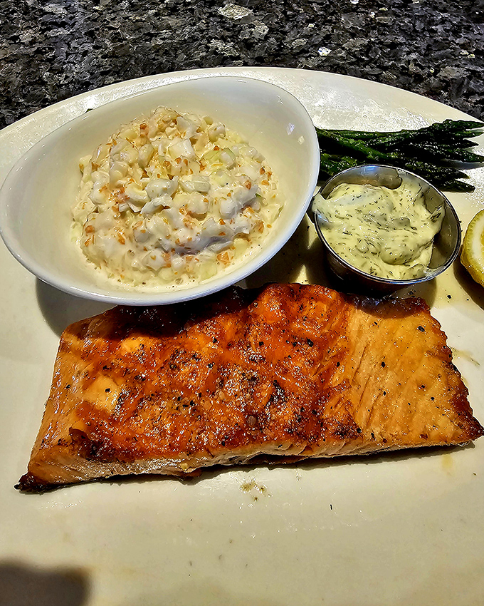 Salmon with that perfect caramelized crust that makes you want to applaud. Paired with creamy corn and asparagus, it's like a well-cast ensemble where everyone gets along.