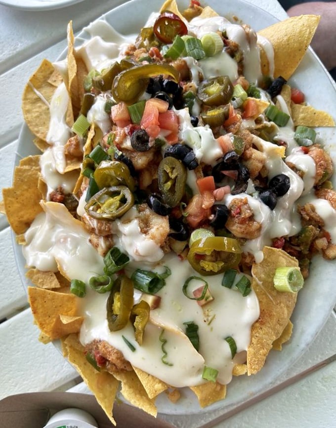 Seafood nachos that could make a grown adult weep with joy. The jalape&ntilde;os aren't just garnish&mdash;they're exclamation points on a crunchy, cheesy masterpiece.