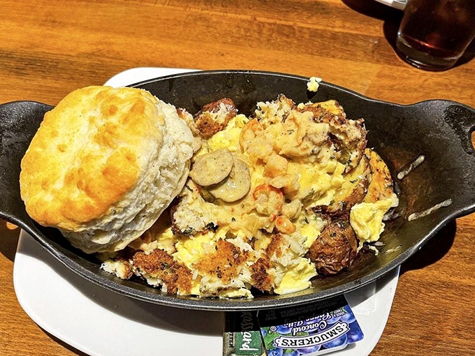 Breakfast skillet magic! A fluffy biscuit crowns this hearty mix of eggs, potatoes, and savory goodness&mdash;the kind of dish that makes mornings worthwhile.