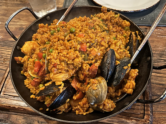 This seafood paella isn't just a dish; it's an edible postcard from the Mediterranean that somehow got mailed to Delaware.