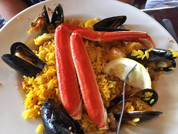 Seafood paella that's basically a beach party in a bowl. Those mussels didn't come here to be wallflowers.