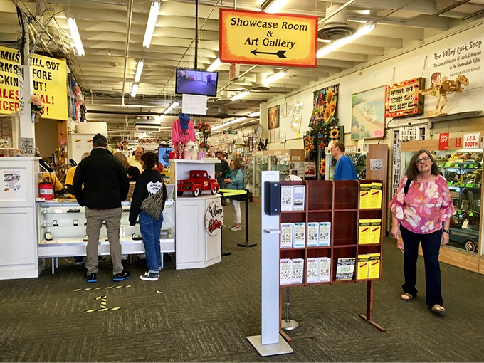 The Showcase Room beckons shoppers with promises of curated finds. Notice how everyone walks with that "I might discover something amazing" posture.