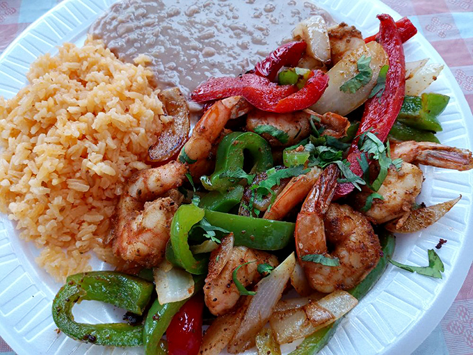 Sizzling shrimp fajitas flanked by Spanish rice and refried beans&mdash;a holy trinity of flavors that would make even a food critic weep with joy.