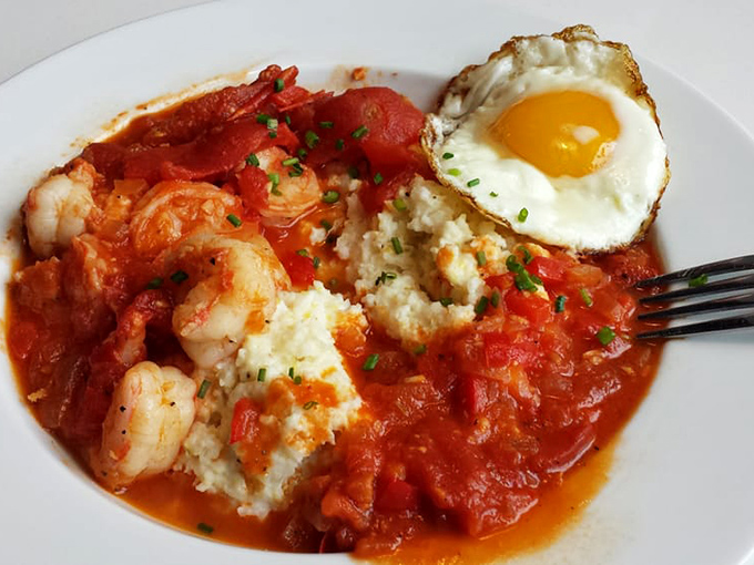 Shrimp and grits that would make a Southerner weep with joy, crowned with a sunny-side egg that's basically wearing a halo.