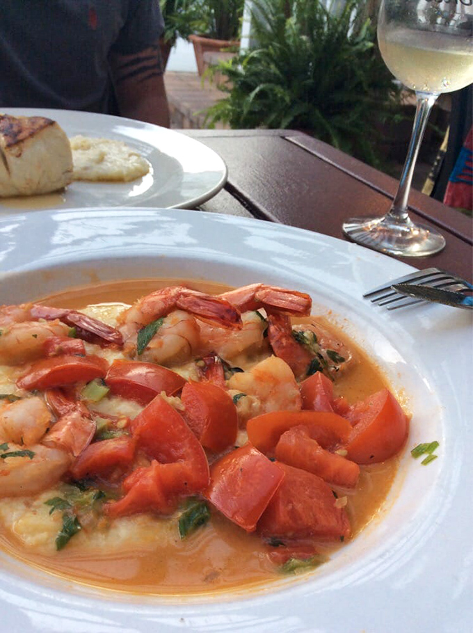 Shrimp and grits elevated to fine art, where Southern comfort meets coastal sophistication beautifully.