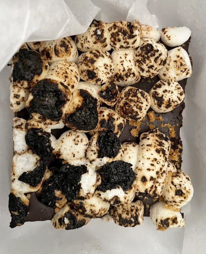S'mores reimagined as a sophisticated dessert bar. The campfire classic gets an urban upgrade that would make both Boy Scouts and pastry chefs nod in approval.