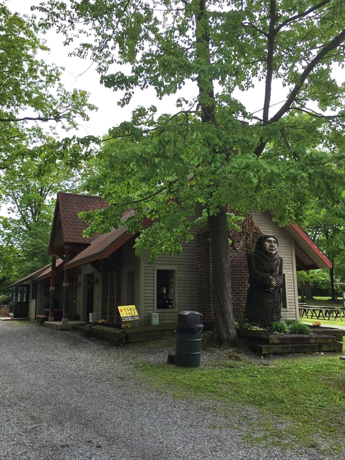 This charming woodland building serves as both landmark and meeting place. That carved wooden figure has probably witnessed thousands of "I can't believe I found this!" moments.