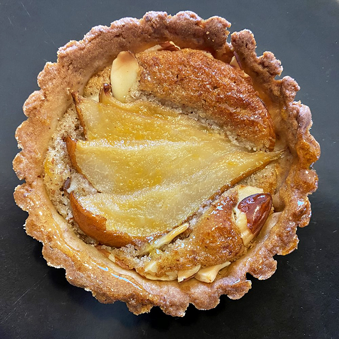 The pear frangipane tart isn't just dessert&mdash;it's edible architecture with a golden crust foundation that would make Frank Lloyd Wright weep with joy.