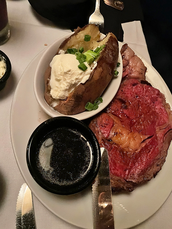 That loaded baked potato deserves its own fan club, but it's the medium-rare prime rib that's the true rockstar of this plate.
