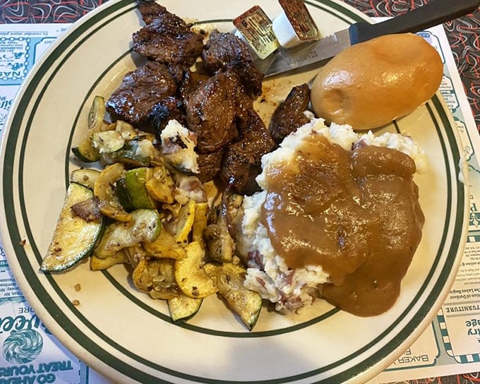 Steak tips with all the fixings&mdash;when the gravy pool meets the mashed potato mountain, magical things happen on this plate.