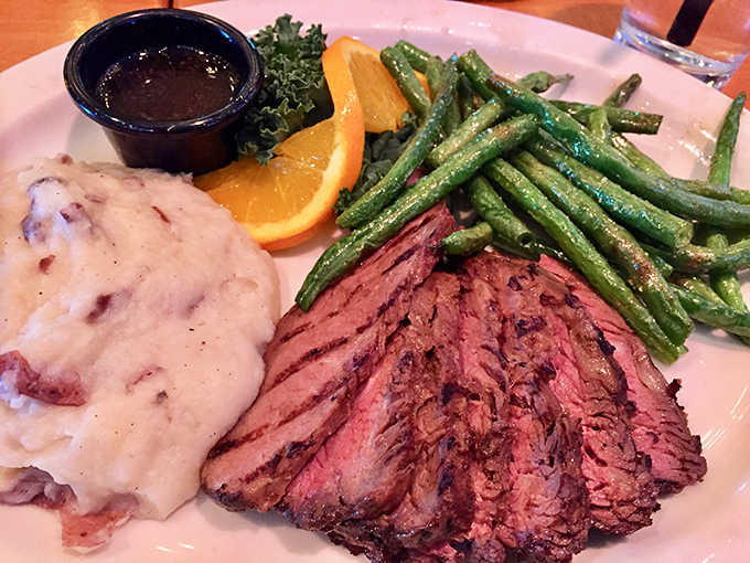 Steak sliced to reveal that perfect pink center, alongside green beans that actually deserve to share the plate. This isn't just dinner&mdash;it's edible artwork.