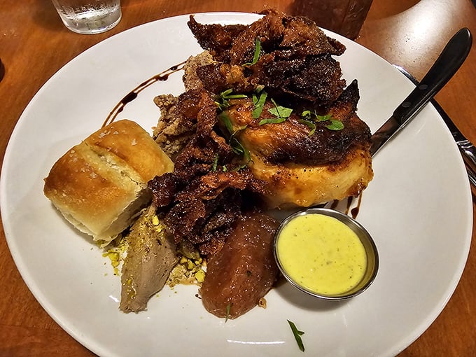Sunday dinner done right. Golden chicken, savory sides, and a roll that's begging to soak up every last drop of that sauce.