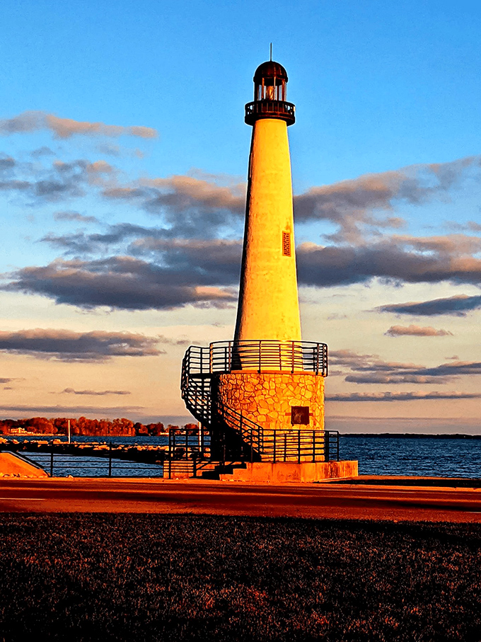 This lighthouse catches the golden hour glow, standing sentinel at Grand Lake St. Marys like a flame-colored exclamation point on the landscape.