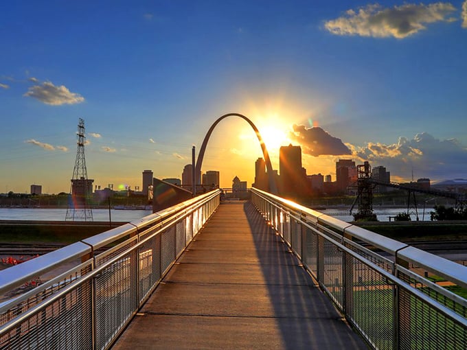 Sunset transforms the Gateway Arch into a golden gateway, visible from Maplewood's nearby parks&mdash;a reminder that affordable living doesn't mean sacrificing spectacular views.