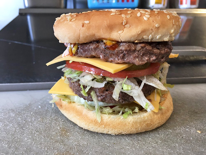 Behold the Super Cheeseburger in all its double-patty glory&mdash;architectural perfection that requires both hands and several napkins.