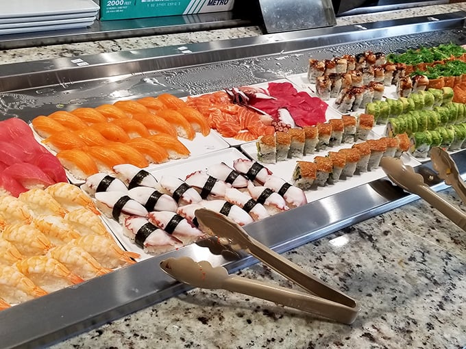 The sushi display is a colorful parade of oceanic delights. In Wisconsin, this many fish together usually requires a fishing tournament.