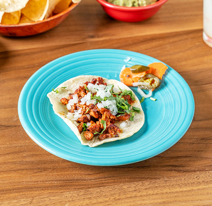 Taco perfection doesn't need to be complicated. This al pastor taco with its caramelized pork and fresh toppings is the haiku of handheld meals.