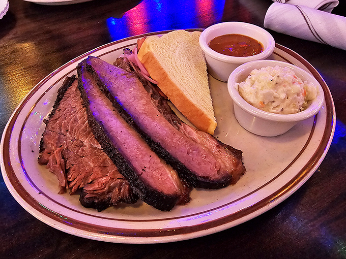 Brisket with that perfect smoke ring is barbecue's equivalent of finding the Holy Grail. The sides aren't afterthoughts—they're worthy companions.