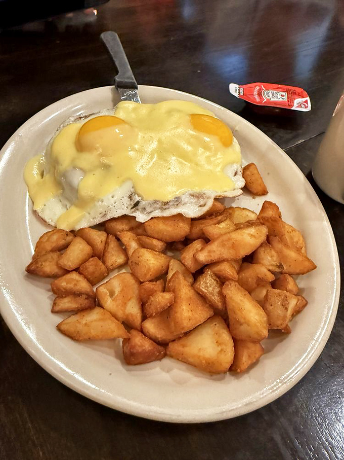 Eggs Benedict gets a German makeover with hollandaise cascading over English muffins like a golden Alpine waterfall. Those home fries aren't just sidekicks!