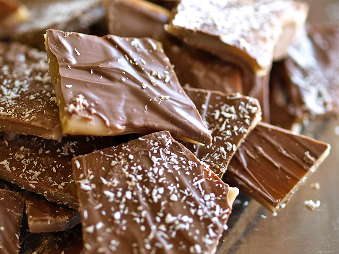 Toffee that shatters with a satisfying crack between your teeth. The layers of buttery caramel and chocolate make even the strongest willpower crumble faster than the candy itself.