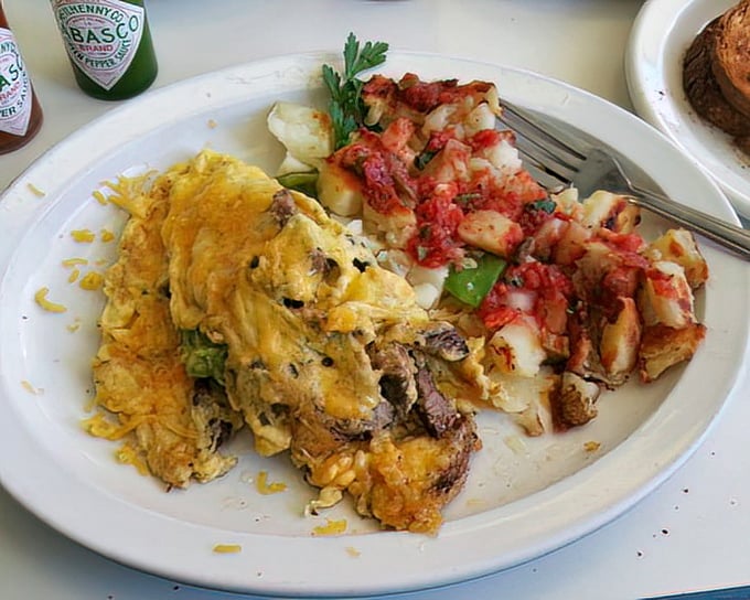Breakfast alchemy at its finest&mdash;a hearty omelet alongside home-style potatoes that somehow manage to be both crispy and tender.