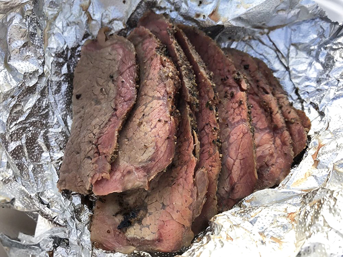 Tri-tip sliced with the precision of a surgeon, revealing that perfect pink center. California's contribution to the barbecue pantheon deserves this kind of respect.