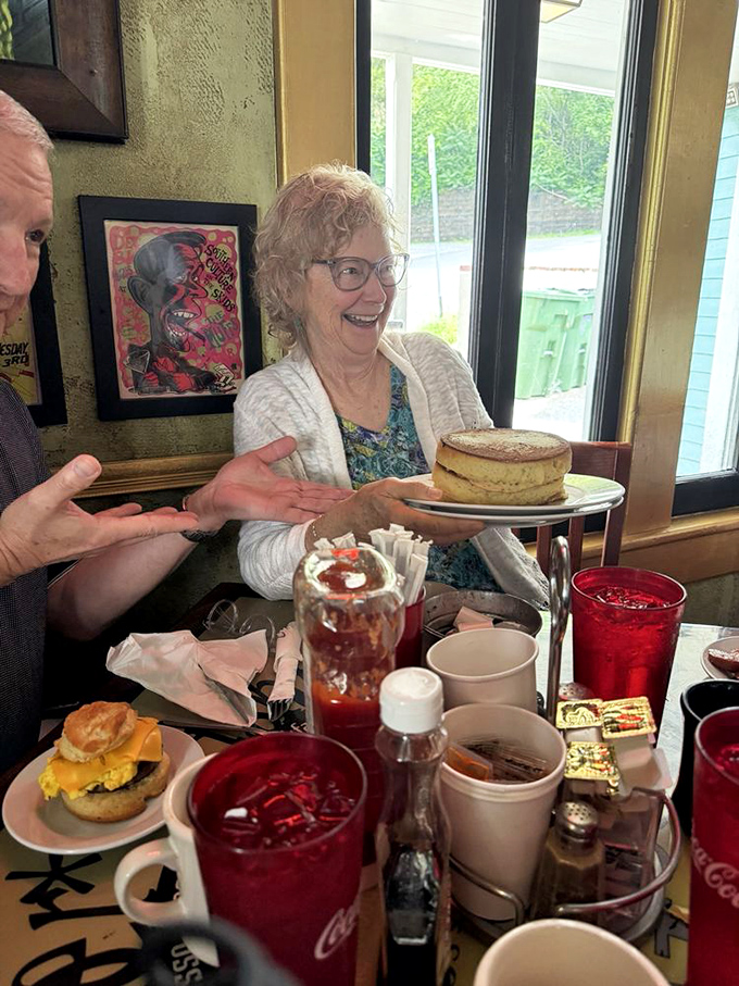 Joy comes in stacks at Aretha Frankensteins. That smile says everything about what's waiting on that plate.