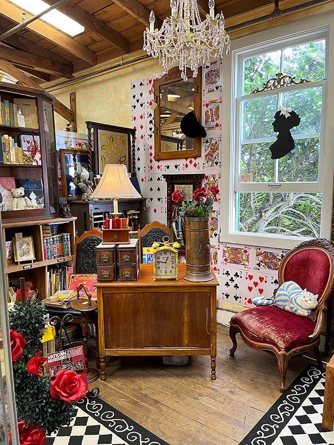 Crystal chandeliers and playing card wallpaper create ambiance that screams "Alice in Wonderland meets antique shop."