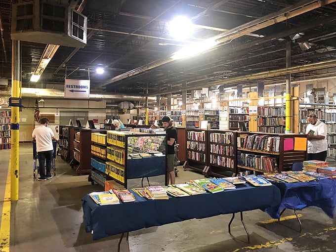 Book hunters in their natural habitat. Notice their focused expressions—that's the look of people who came for one book and will leave with twelve.