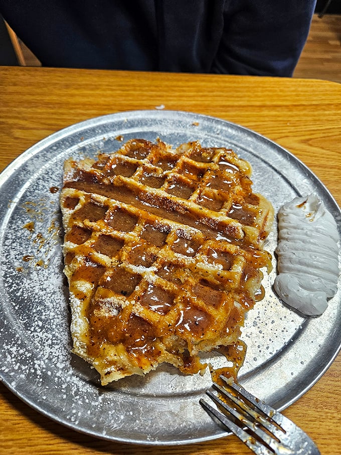 Golden, crispy, and ready for its close-up&mdash;this waffle isn't just food, it's architecture with those perfect grid indentations holding sweet syrup.