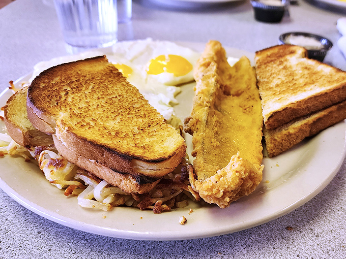 Golden toast triangles stand at attention beside a perfectly fried walleye filet&mdash;Wisconsin's way of saying "good morning" with a wink and a nod.
