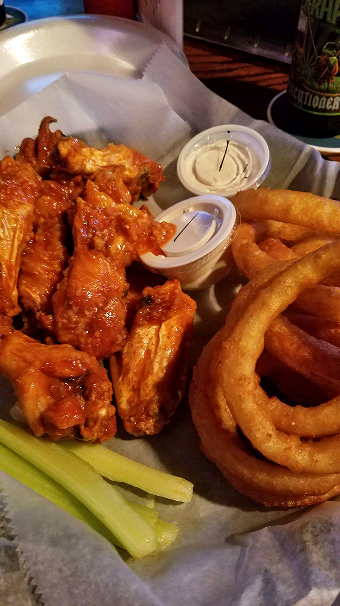 Buffalo wings and onion rings: the dynamic duo of bar food that's turned more casual dinners into memorable feasts than any white tablecloth ever could.
