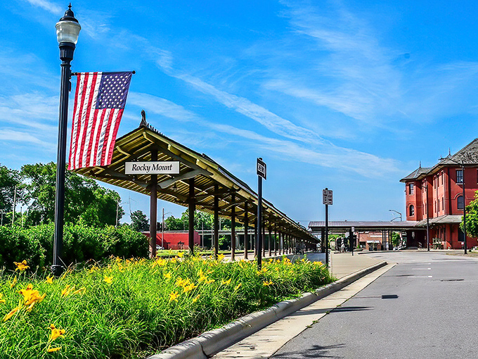 The Rocky Mount train station welcomes travelers with small-town charm, while the American flag reminds visitors of the city's patriotic spirit.