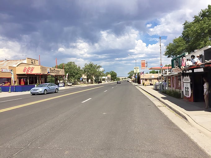 Storm clouds gather over Seligman's main drag, adding dramatic flair to a street that's seen decades of American travelers seeking the authentic West.