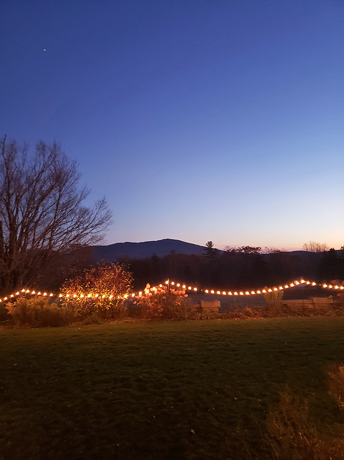 When the sun sets behind Mount Monadnock, string lights transform ordinary gardens into magical spaces where summer memories are made.