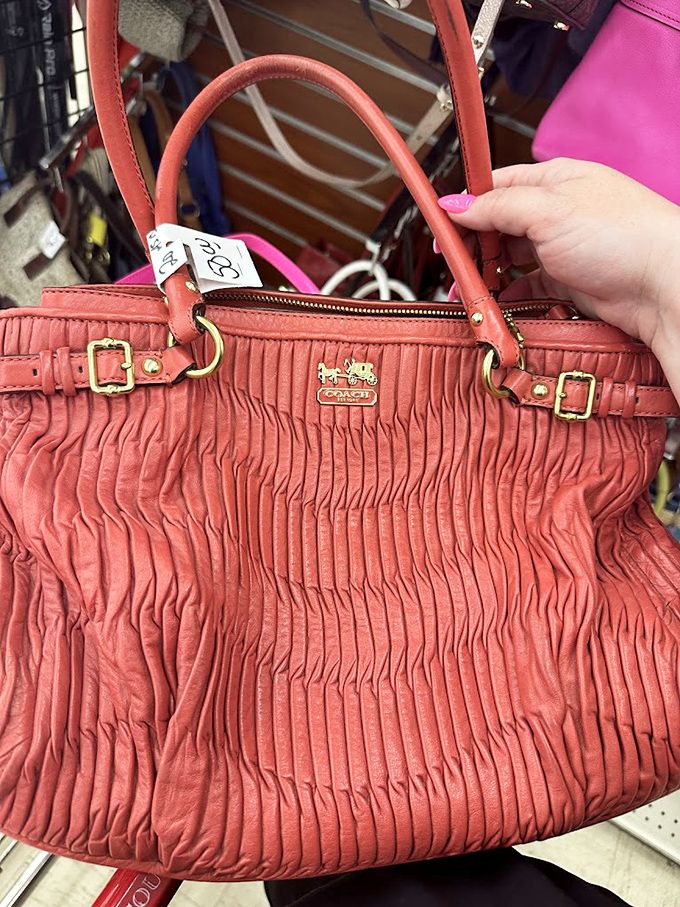 Designer bags at thrift store prices? That coral Coach purse represents the holy grail of thrifting&mdash;luxury fashion without the luxury price tag.