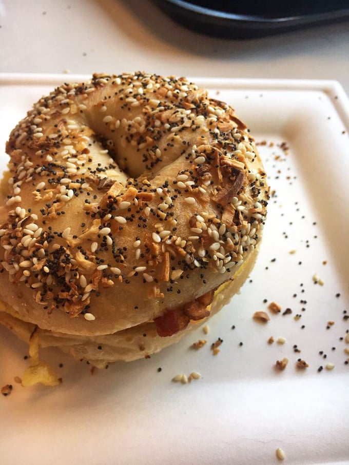The everything bagel&mdash;where seeds gather for their annual convention and cheese peeks out like a shy but curious neighbor.