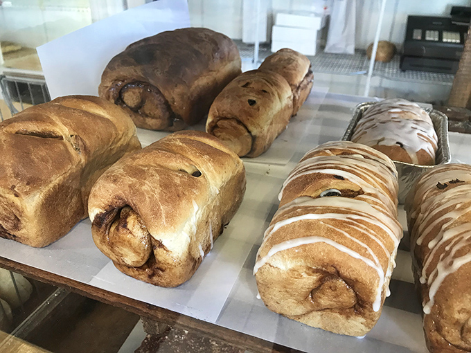 Sweet breads lined up like edible works of art. The cinnamon swirl is practically hypnotizing you to take it home.