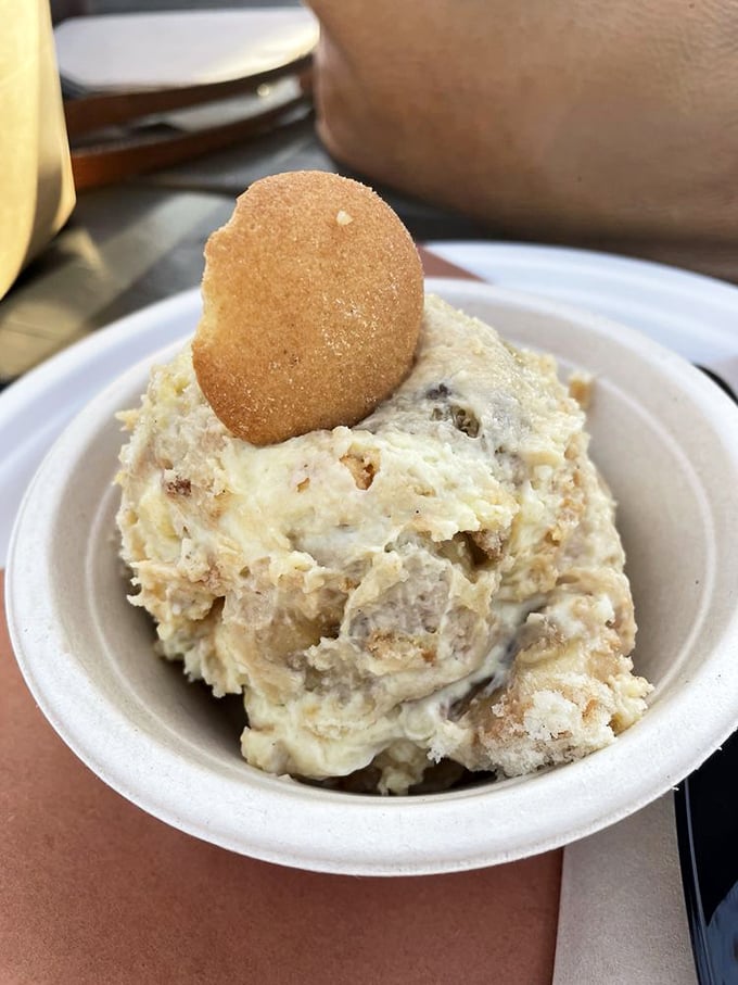 Banana pudding that makes grown adults consider licking the container. The vanilla wafer on top is just showing off.