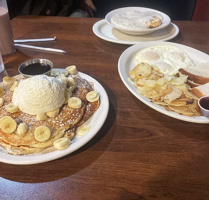 Pancake perfection topped with bananas and possibility. That scoop of butter melting on top is performing a slow dance that deserves applause.
