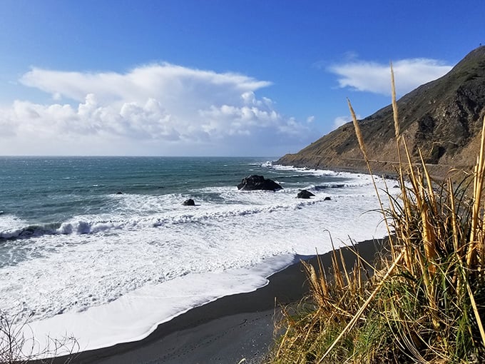 The rhythmic percussion of waves against this black sand beach creates nature's most soothing soundtrack. No noise-canceling headphones can compete with this.