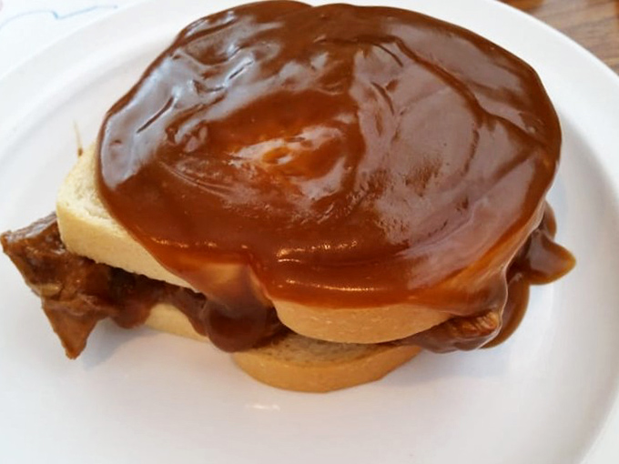 Gravy so rich it could buy a yacht, cascading over bread that's standing its ground with dignity. This sandwich doesn't need Instagram&mdash;it needs your full attention.